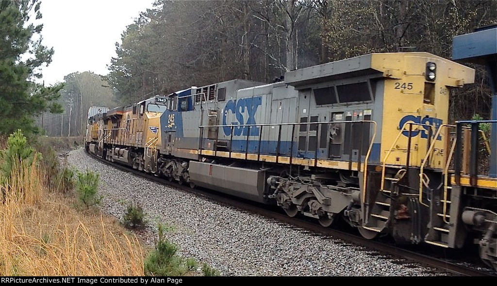 CSX 245 and UP 7643 and 6031 slowly approach a red signal